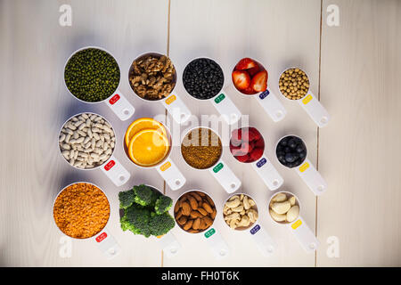 Portion cups of healthy ingredients Stock Photo - Alamy