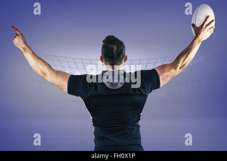 Composite image of rugby player celebrating with the ball Stock Photo ...