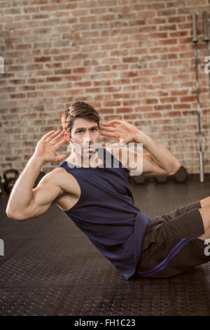 Handsome Bodybuilder Doing Heavy Weight Exercise For Back On Machine ...