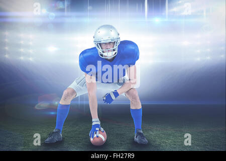 Composite image of alert american football player in attack stance ...
