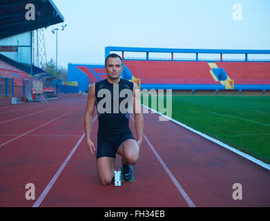 Athletic man start Stock Photo - Alamy