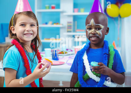 Happy kids enjoying tasty buns Stock Photo - Alamy