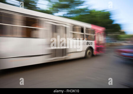 Metro bus speeding along the road at the El Malecon, Havana, Cuba, West ...