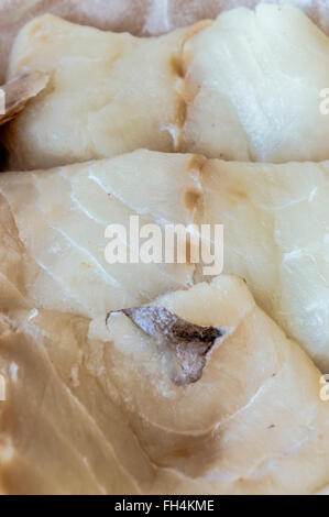 Pieces of raw cod fish isolated on white Stock Photo - Alamy