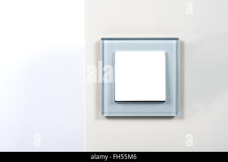 light switch with silver glass frame on the wall Stock Photo - Alamy