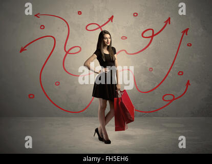 Stylish woman shopping and red arrows Stock Photo - Alamy