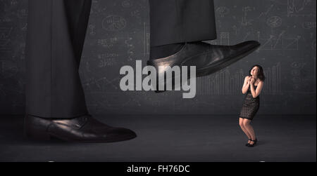 Huge leg stepping on a tiny businnesswoman concept Stock Photo - Alamy
