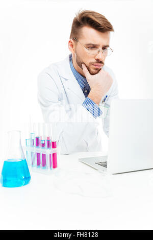 Male scientist using laptop in laboratory Stock Photo - Alamy