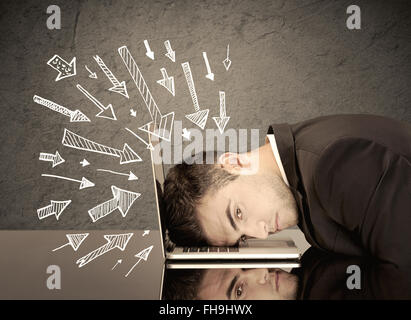 Arrows pointing at sad office worker Stock Photo - Alamy