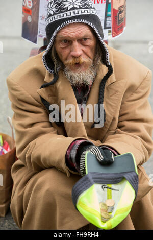 Elderly male panhandler on street corner in Chinatown-Victoria, British ...