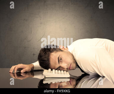 Frustrated businessman's head on keyboard Stock Photo - Alamy