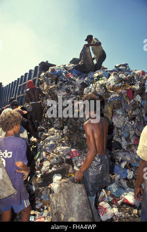 Child labor, pickers sort through garbage finding recyclables as a ...
