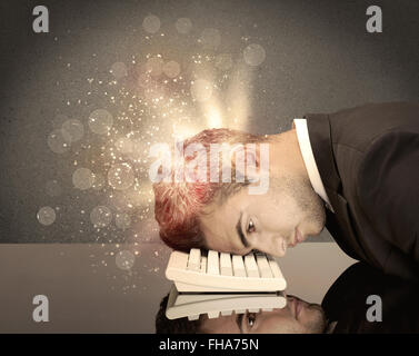 Angry businessman with lights and keyboard Stock Photo - Alamy