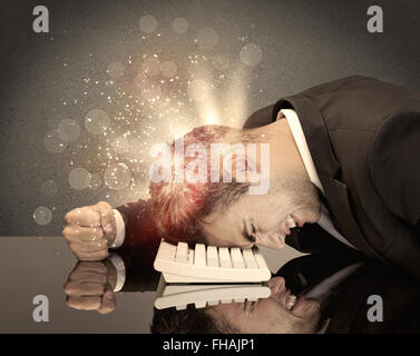 Angry businessman with lights and keyboard Stock Photo - Alamy