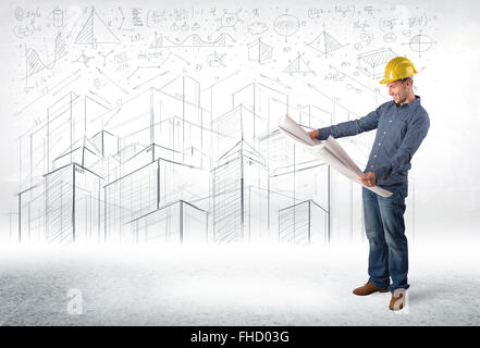 Handsome architect drawing with helmet Stock Photo - Alamy