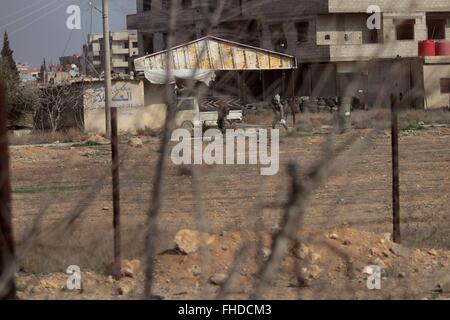 Daraya, Damascus. 24th February, 2016. Syrian soldiers walk past ...