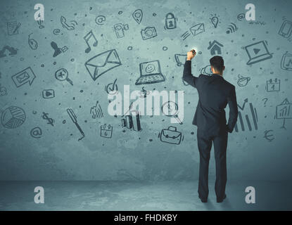 businessman drawing social media icons Stock Photo - Alamy
