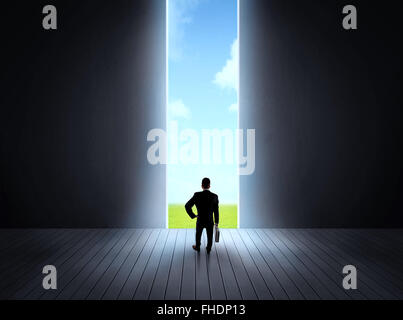 businessman walking to open gate Stock Photo - Alamy