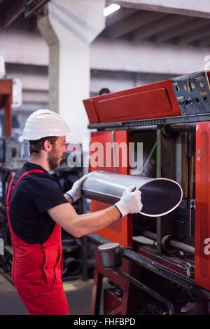 Man dressed white protective overalls spraying surface antibacterial ...