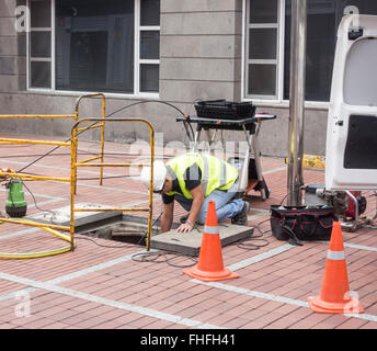 A BT engineer laying cables Stock Photo - Alamy