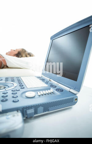 Pregnant woman receiving a medical ultrasound, monitoring prenatal baby ...