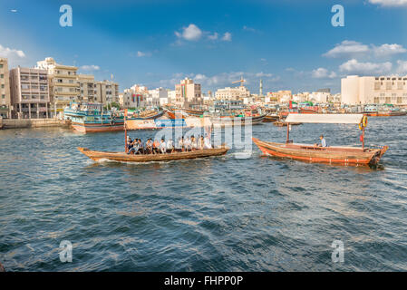 Traditional Abra water taxi crossing the Dubai Creek, United Arab ...