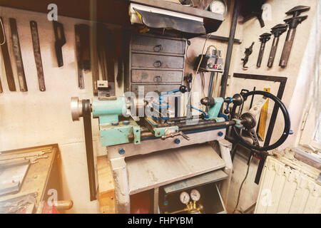 Home maintenance - An untidy workbench full of dusty old tools and ...