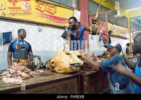 ACCRA, GHANA - JANUARY 2016: Butchers preparing and selling the meat in ...