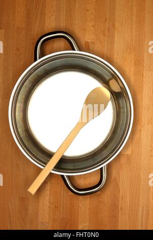 Pots and pans on a wooden kitchen bench Stock Photo - Alamy