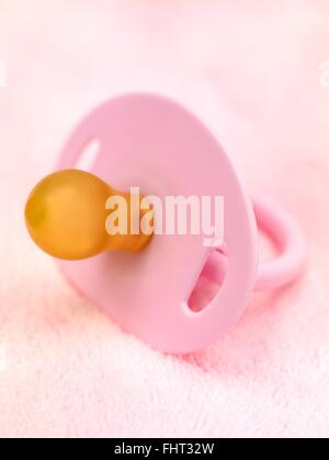 New pink baby pacifier isolated on white Stock Photo - Alamy