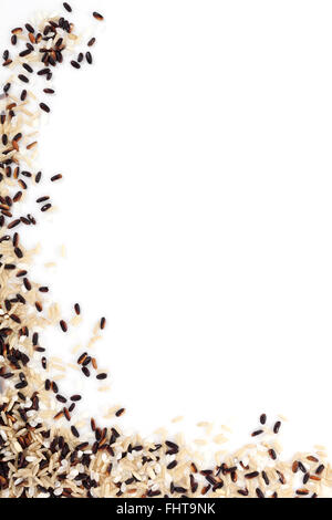 White and forbidden rice with chopsticks on dark wooden background. Top ...