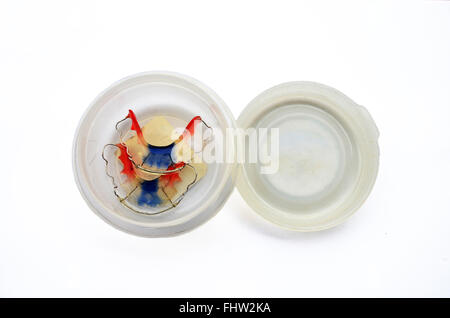 Retainer fashion in white plastic box Stock Photo - Alamy