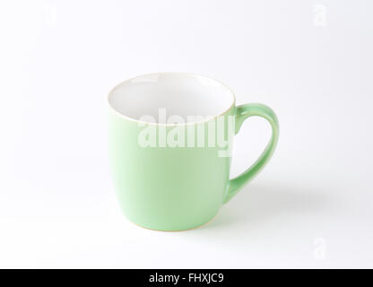 Empty green mug on a white background Stock Photo - Alamy