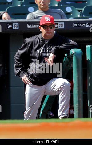 Houston head coach Todd Whitting, center, argues with umpires if a hit ...