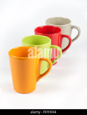 Four color tea cups shown in row white background Stock Photo - Alamy