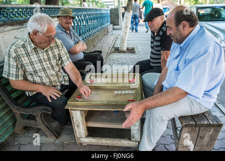 Group of men playing Nardi board game (backgammon) in Borjomi resort ...