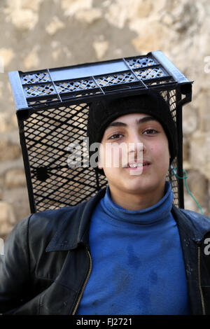 Portrait of a handsome young Kurdish man from the city of Midyat, in ...