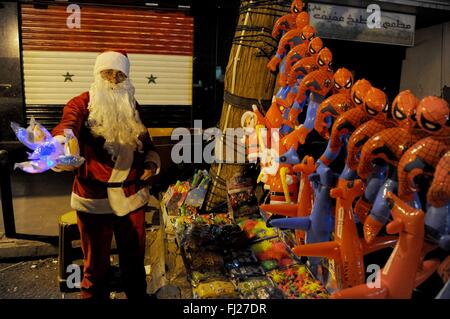 A Syrian man sells balloons in the old city of Damascus, Syria ...