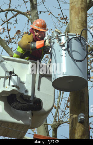 Utility worker working on a electrical transformer Stock Photo - Alamy