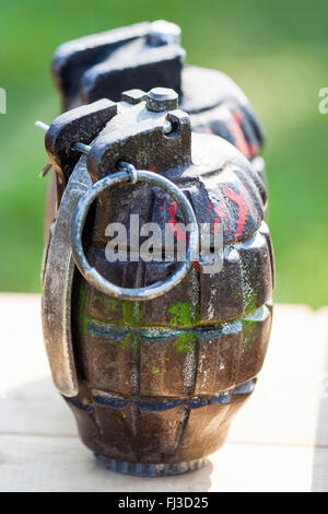 British mills bomb hand grenades in soldiers helmet Stock Photo - Alamy