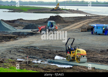 dyke construction and reinforcement at the Wederland. In the background ...