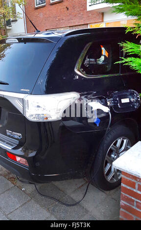 Electric car when charging, detail, loading flap, charging plug ...