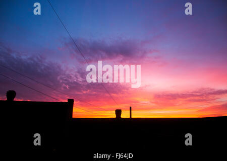 Colourful sunset seen over rooftops in the city centre of Bristol Stock ...