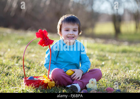Happy siblings sharing playground basket swing in sunny park Stock ...