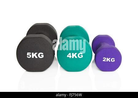 Purple dumbbells on black background Stock Photo - Alamy