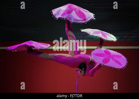 An acrobat of China s Guangdong Acrobatic Troupe performs during the ...