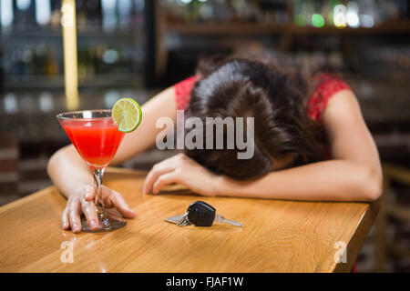 drunk woman driver leaning on counter Stock Photo - Alamy