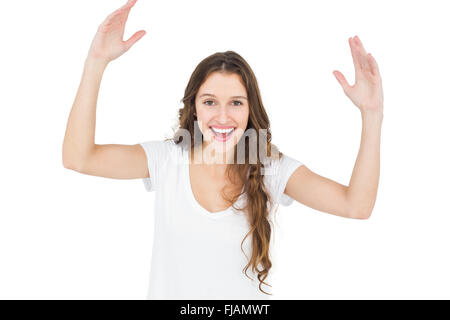 smiling woman raising hands and looking up Stock Photo - Alamy