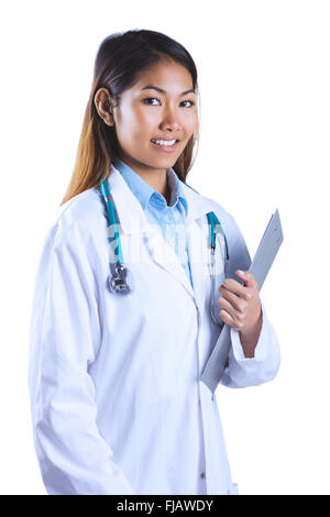 Young asian doctor woman holding smartphone over isolated background ...