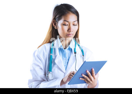 Young Asian female doctor using digital tablet talking on phone for ...